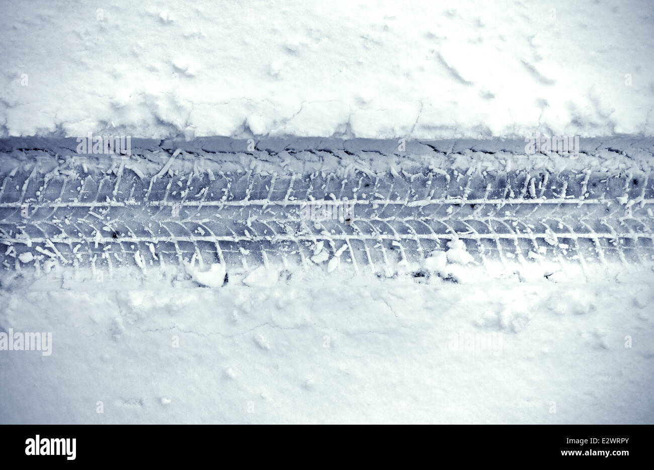 Detail of cars tire track in snow Stock Photo - Alamy