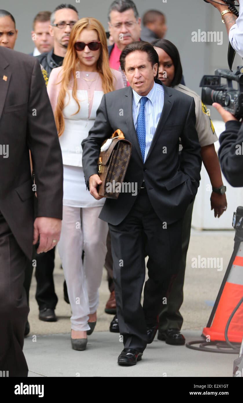 Lindsay Lohan exits the courthouse with her attorney Mark Heller after receiving a 90 day rehab ...