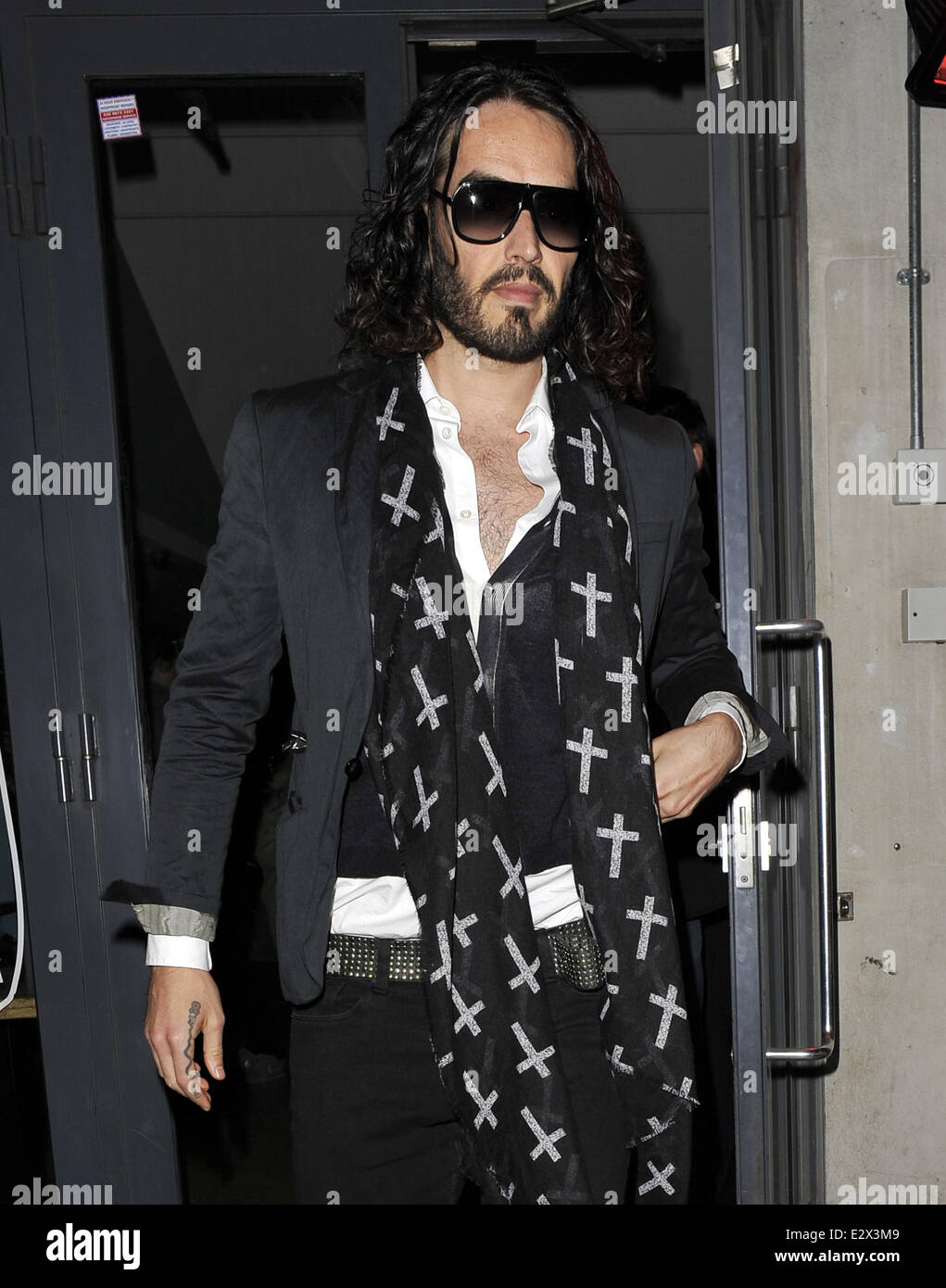 Russell Brand leaving the Soho Theatre wearing a crucifix patterned ...