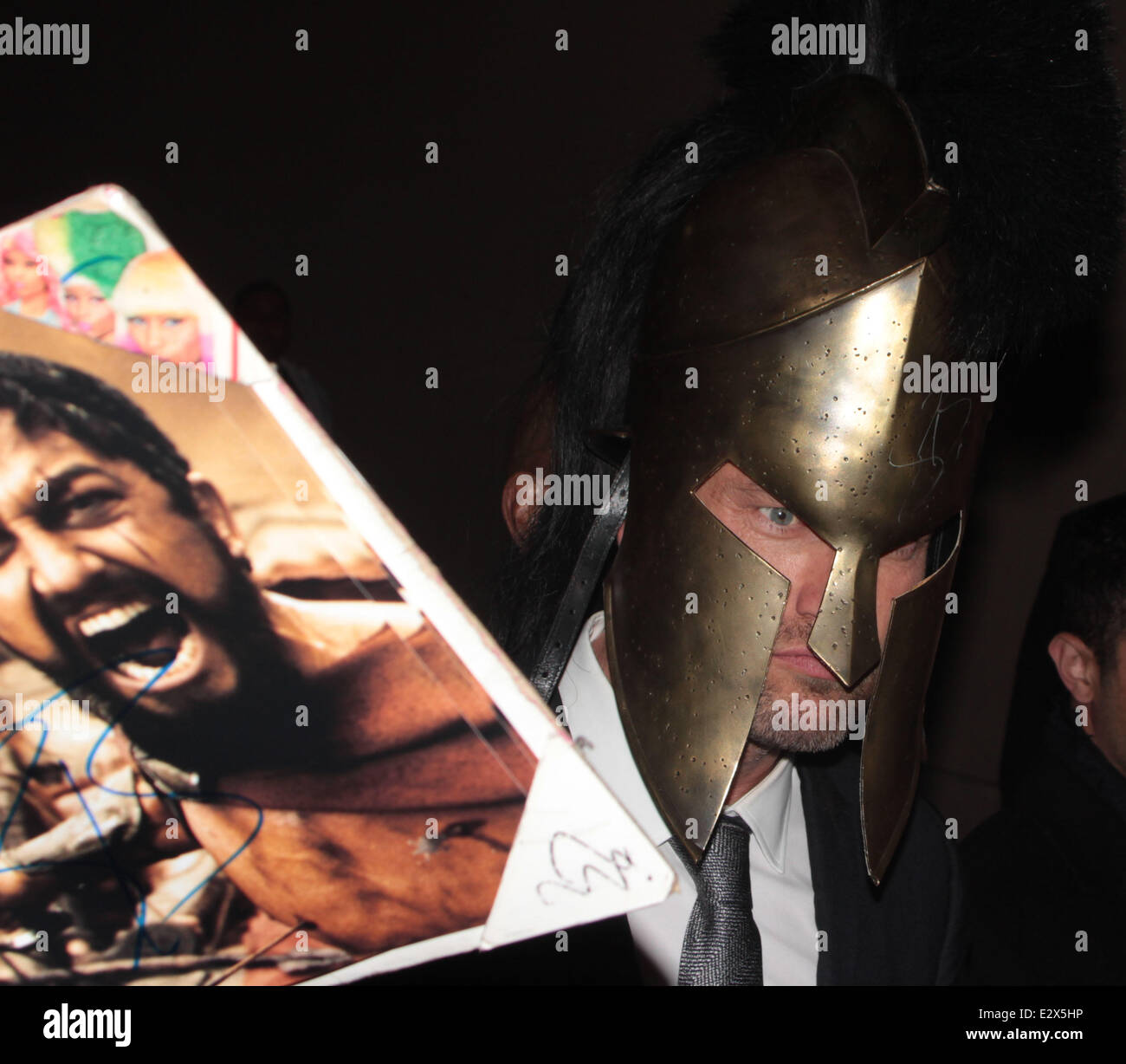 Gerard Butler dons his Spartan helmet as he meets and greets the fans ...