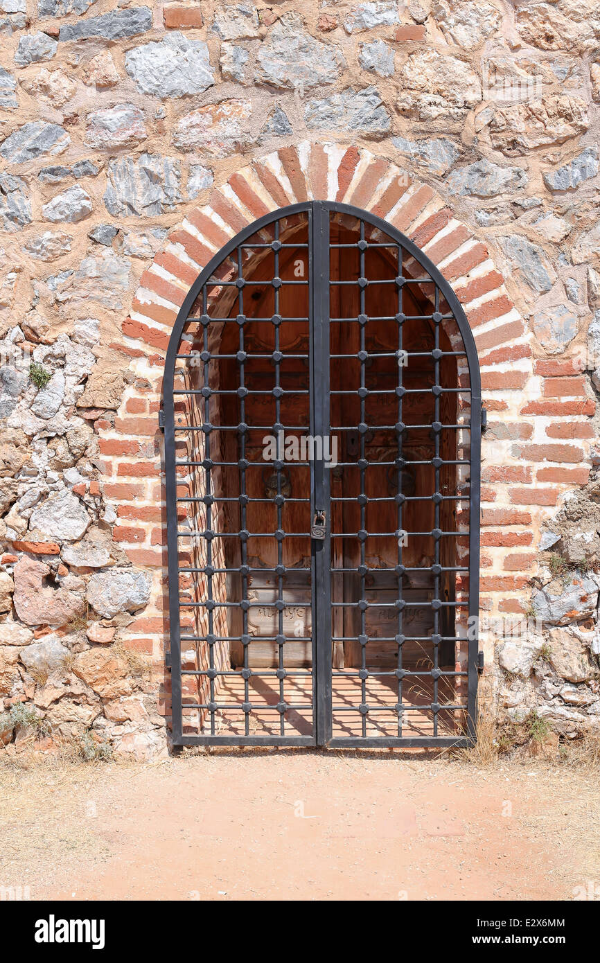 The wooden gate locked with steel grating front view Stock Photo - Alamy