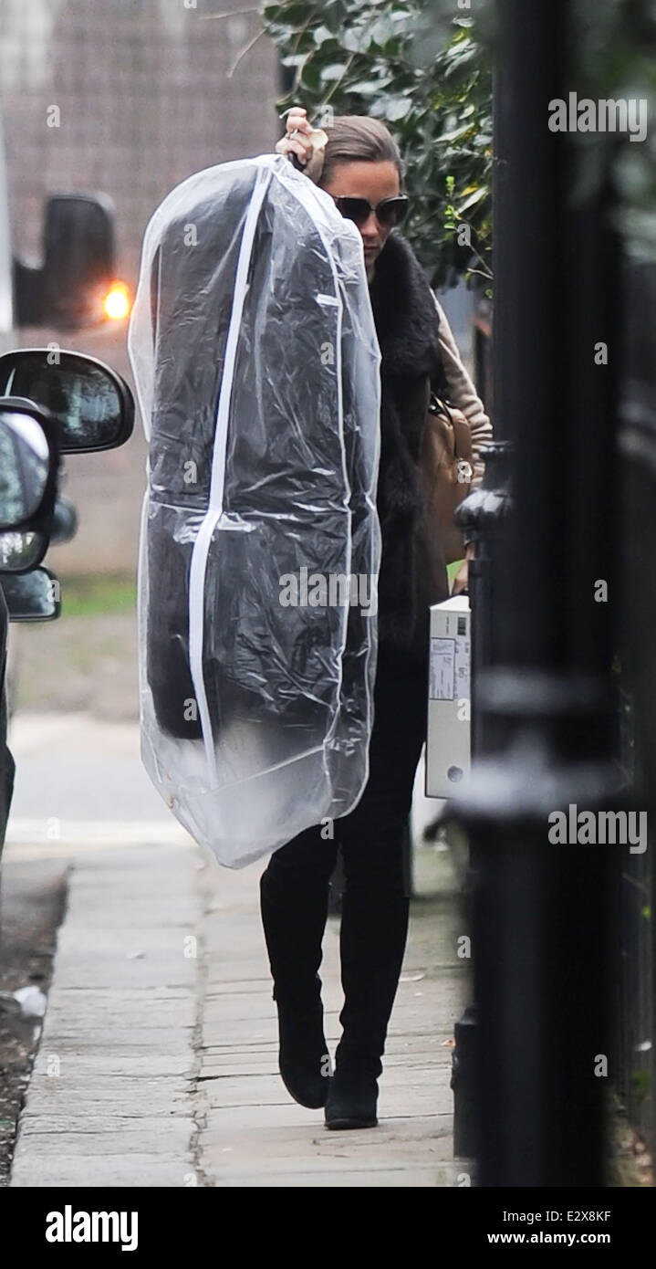 Pippa Middleton plays hide and seek with the photographers by hiding ...