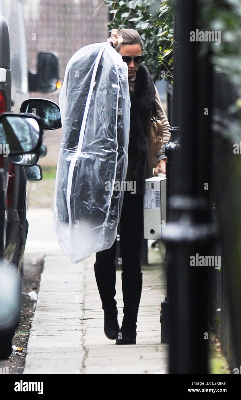 Pippa Middleton plays hide and seek with the photographers by hiding ...