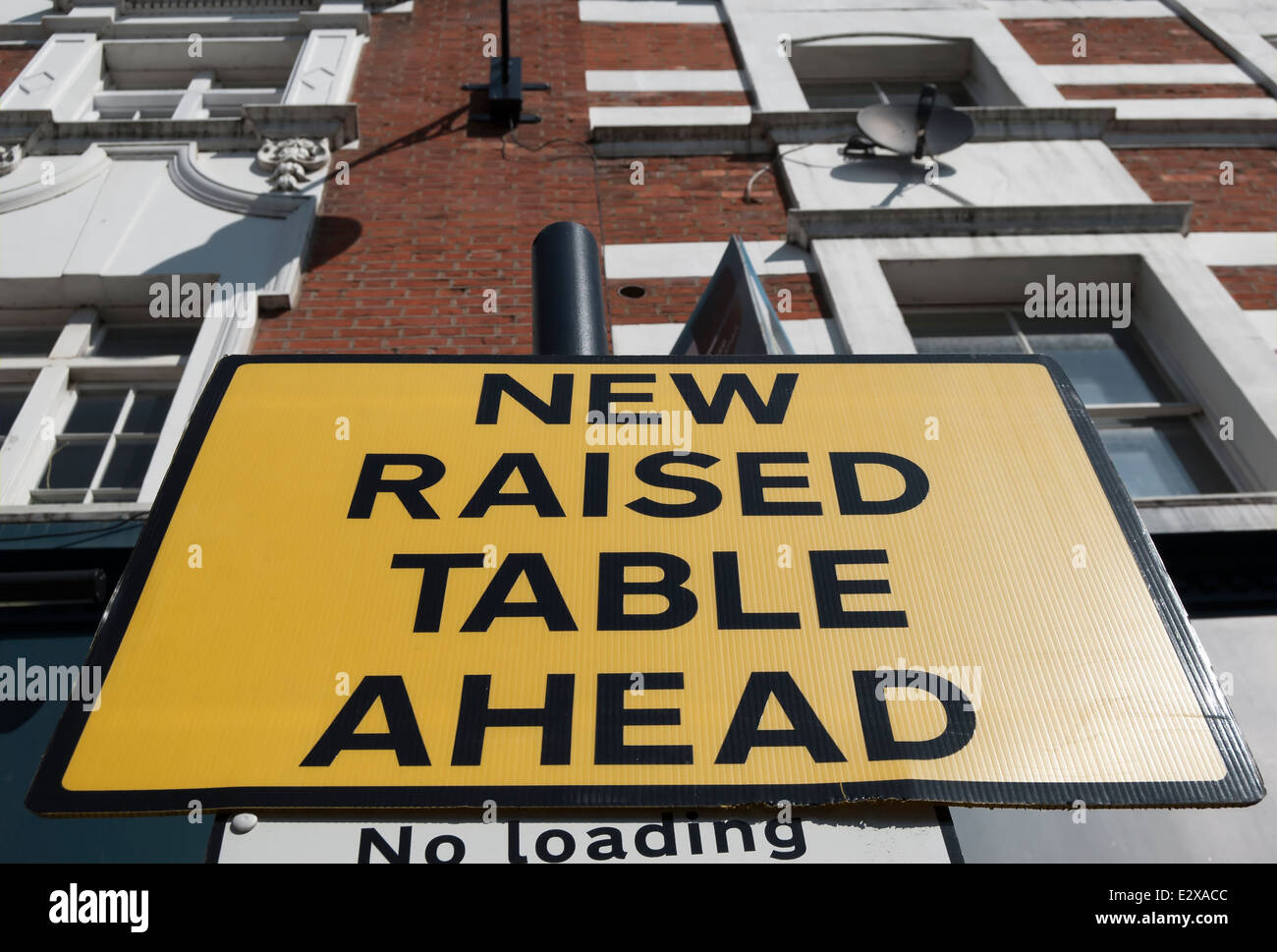 british road sign stating new raised table ahead Stock Photo - Alamy