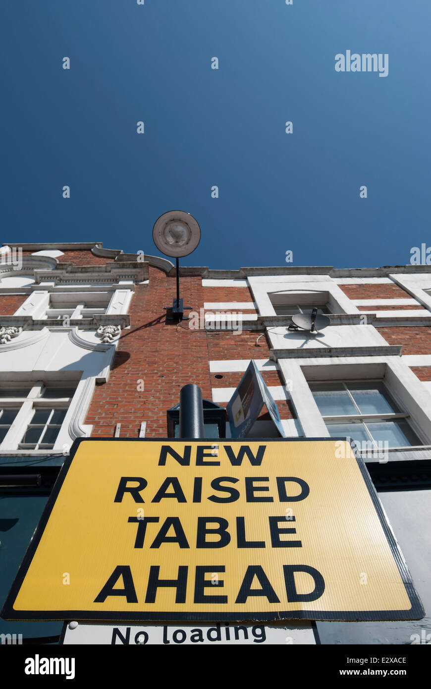british road sign stating new raised table ahead Stock Photo - Alamy