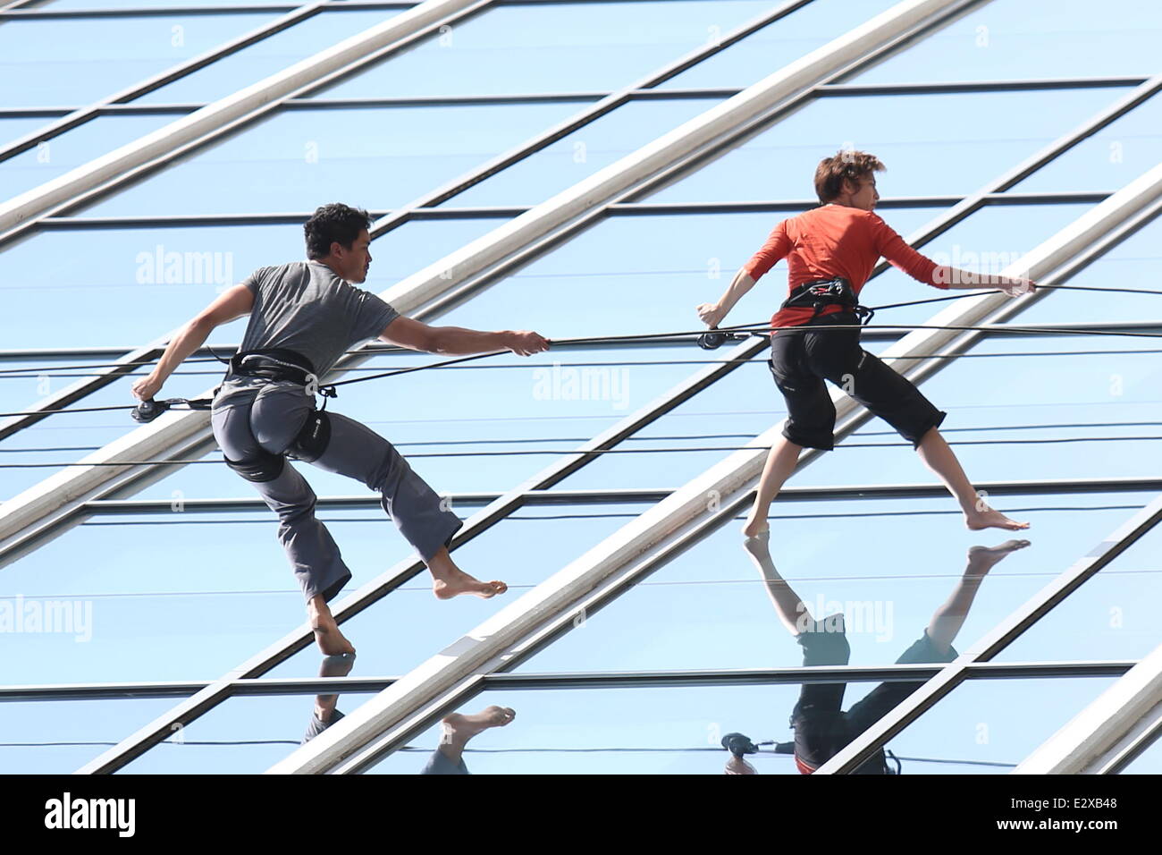 Two dancers strut their stuff while abseiling down the side of an ...