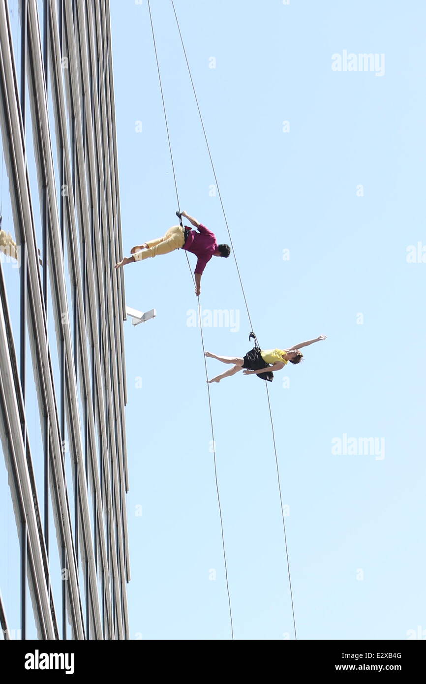 Two dancers strut their stuff while abseiling down the side of an ...