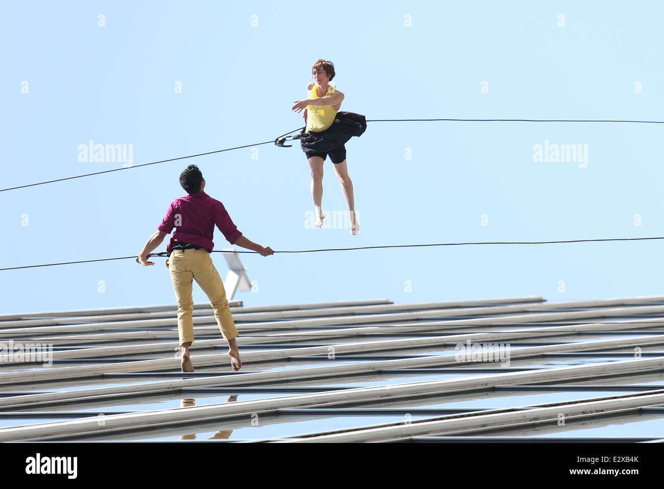 Two dancers strut their stuff while abseiling down the side of an ...