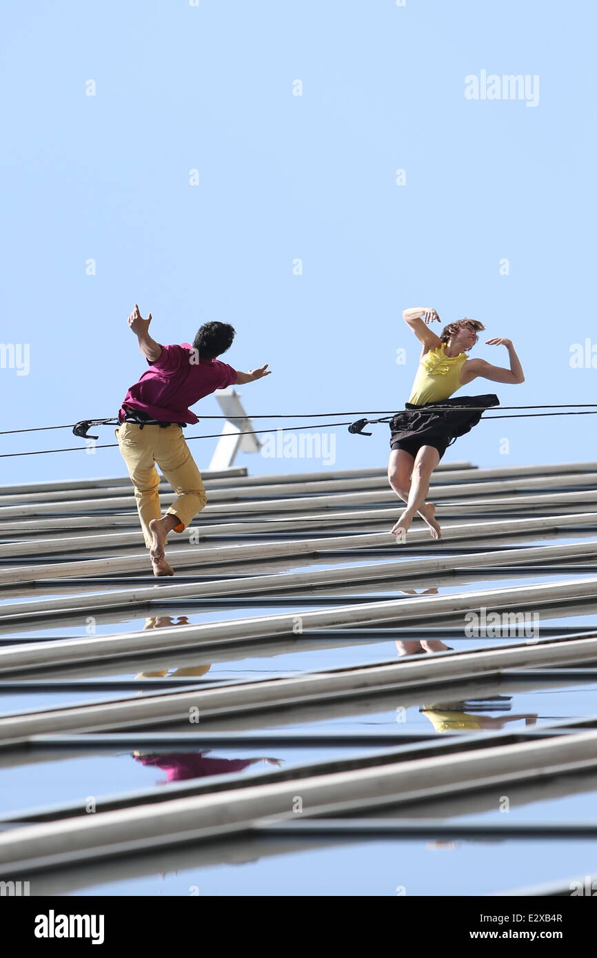 Two dancers strut their stuff while abseiling down the side of an ...