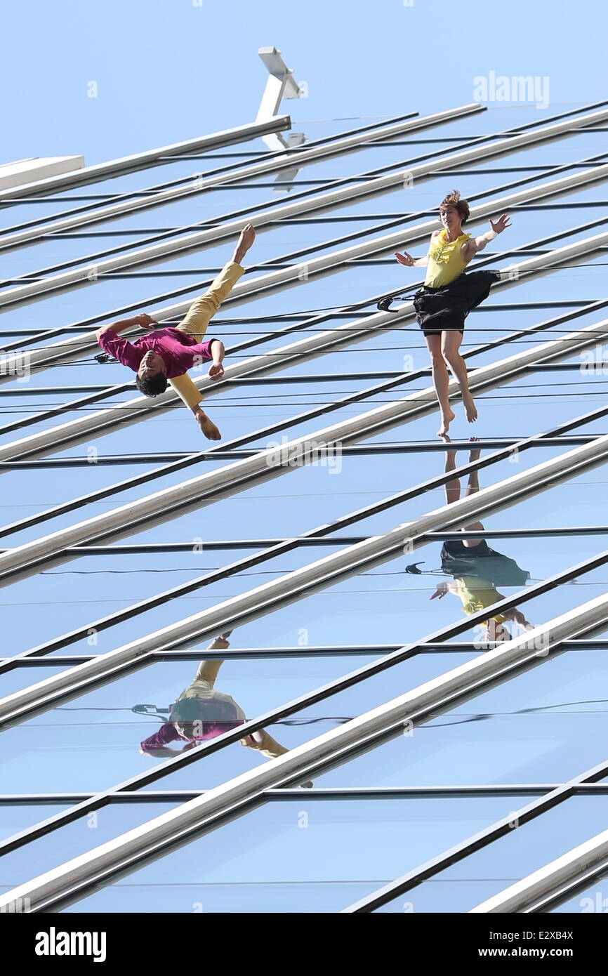 Two dancers strut their stuff while abseiling down the side of an ...