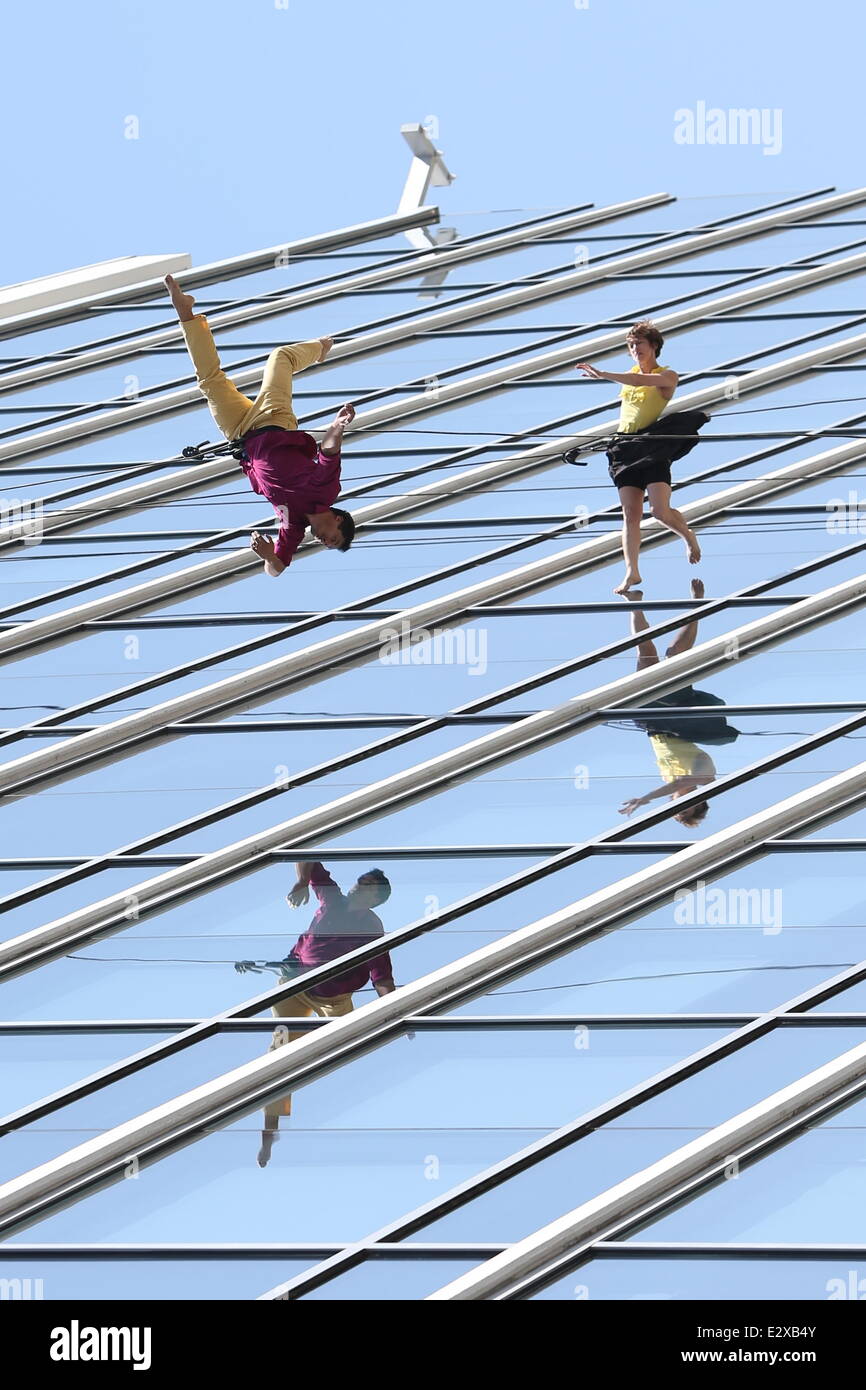 Two dancers strut their stuff while abseiling down the side of an ...