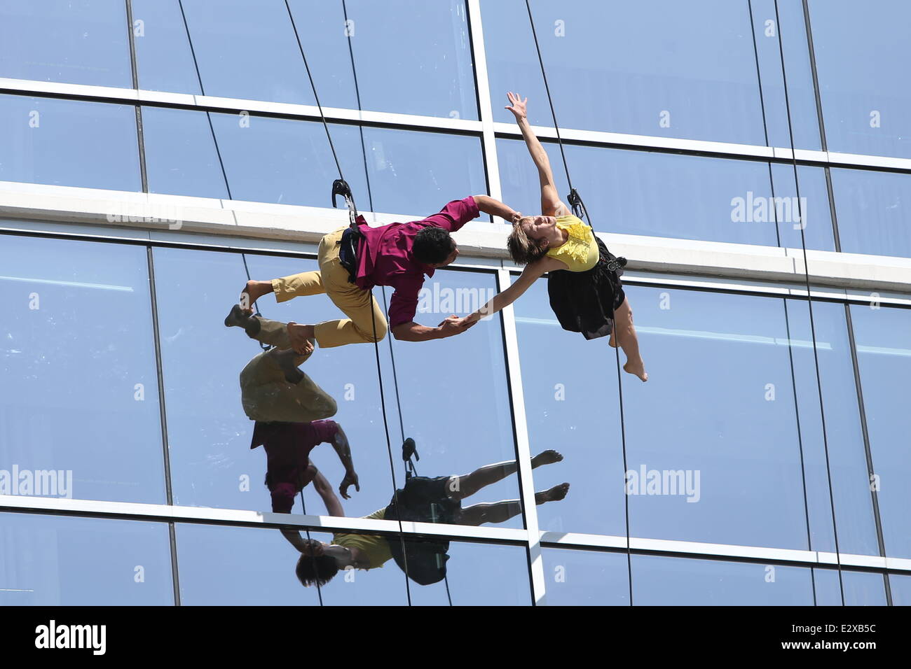 Two dancers strut their stuff while abseiling down the side of an ...