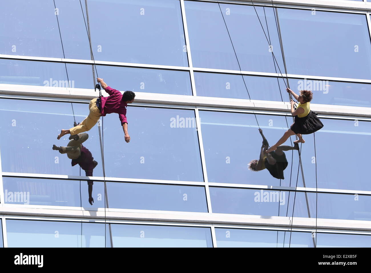 Two dancers strut their stuff while abseiling down the side of an ...