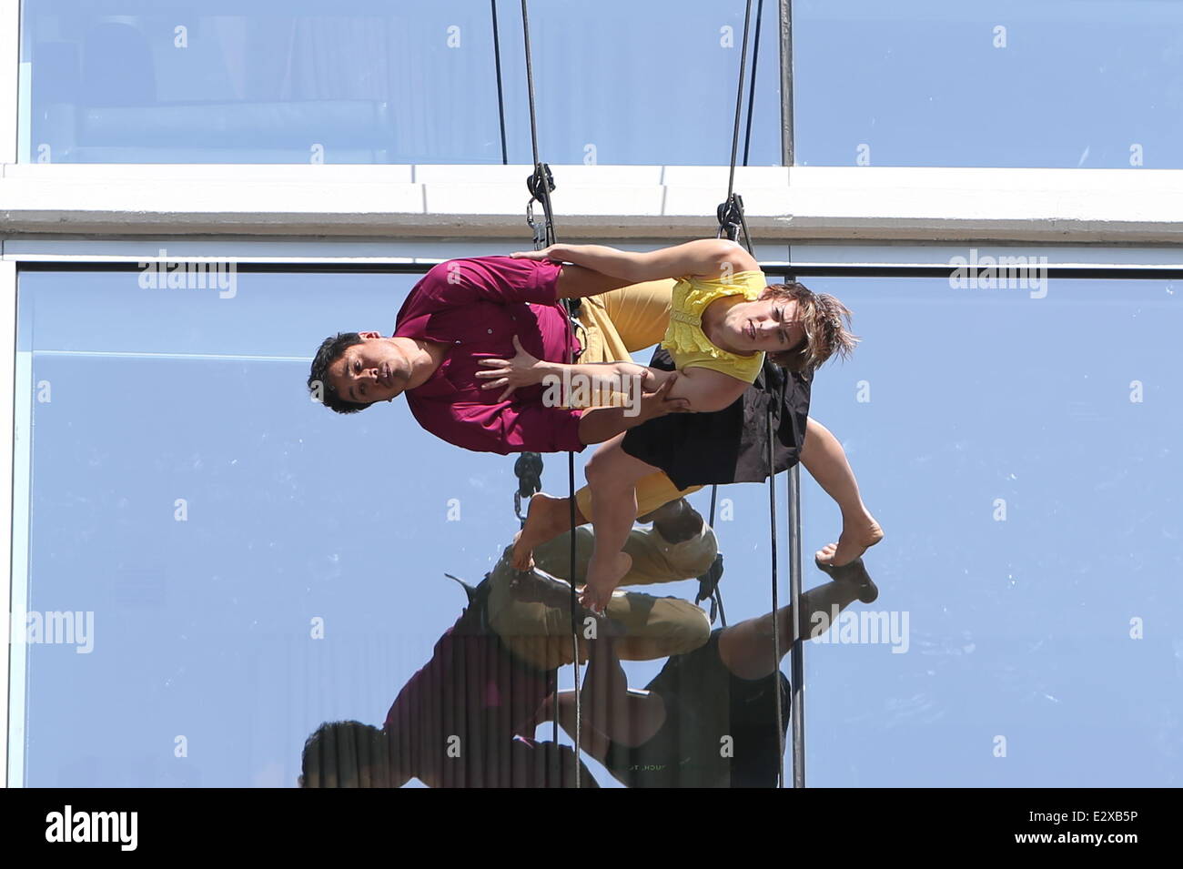 Two dancers strut their stuff while abseiling down the side of an ...