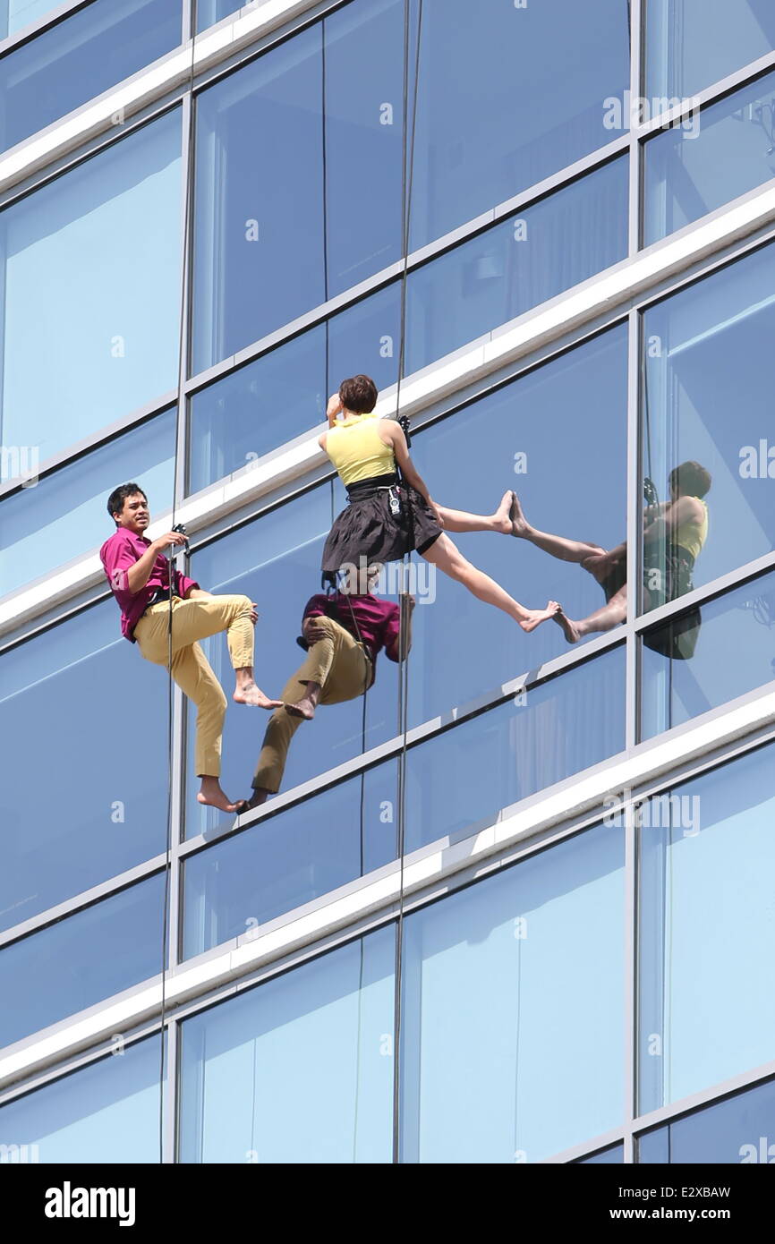 Two dancers strut their stuff while abseiling down the side of an ...