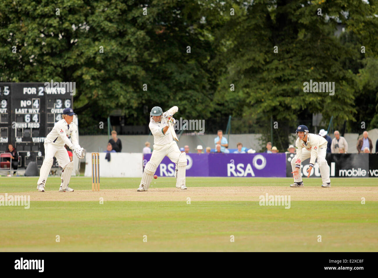 Men playing cricket at a match during the Cheltenham Cricket festival ...