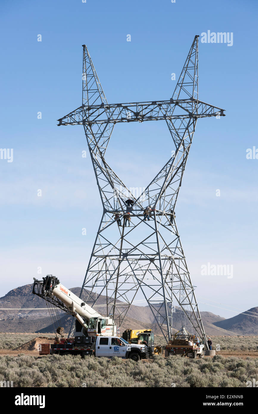 Construction crew assembling electricity transmission tower in Utah ...