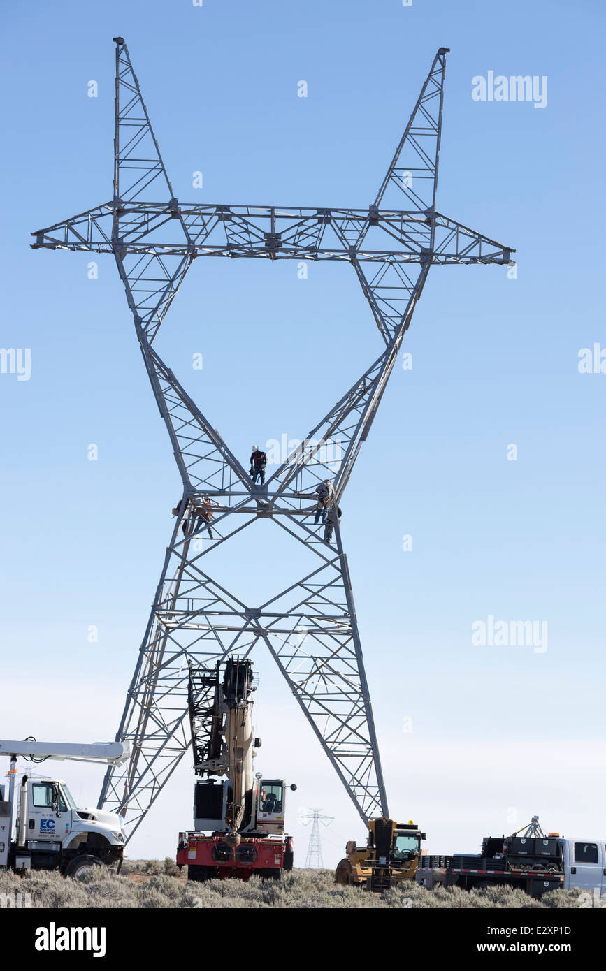 Construction crew assembling electricity transmission tower in Utah ...