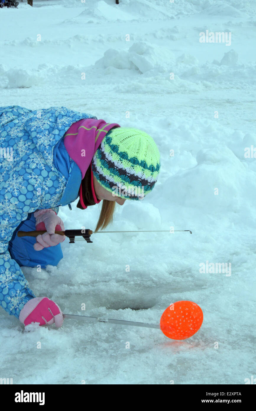 Children engage in ice fishing on the Upper Mississippi River within ...