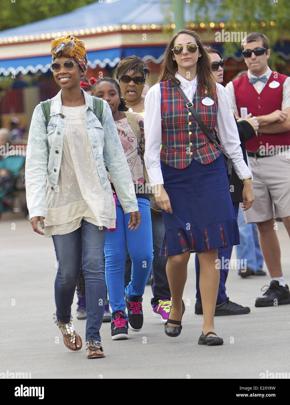 Brandy Norwood walking through Disney's California Adventure Theme park ...