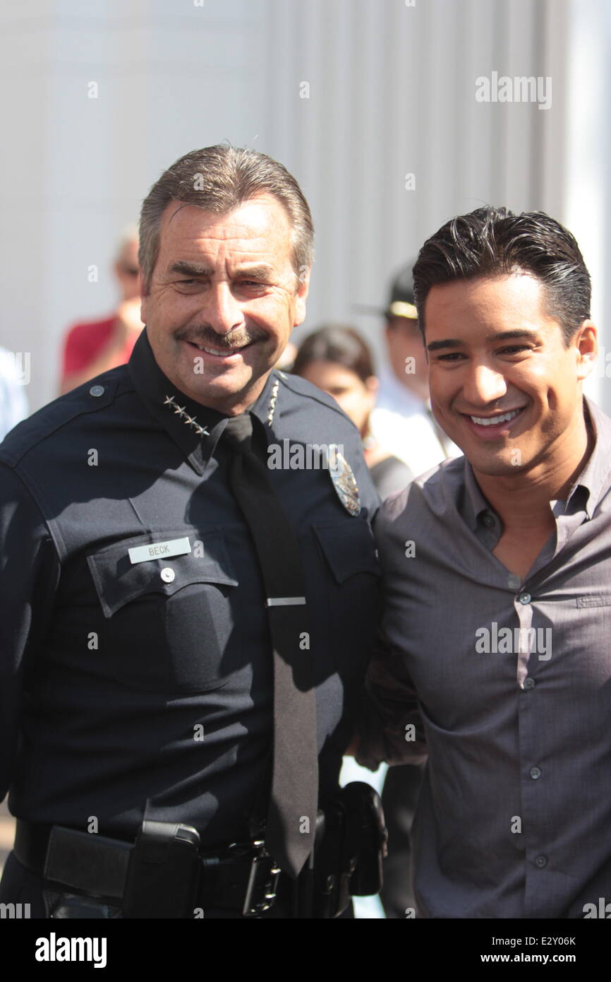 Mario Lopez poses with an officer at The Grove Featuring: Mario Lopez ...
