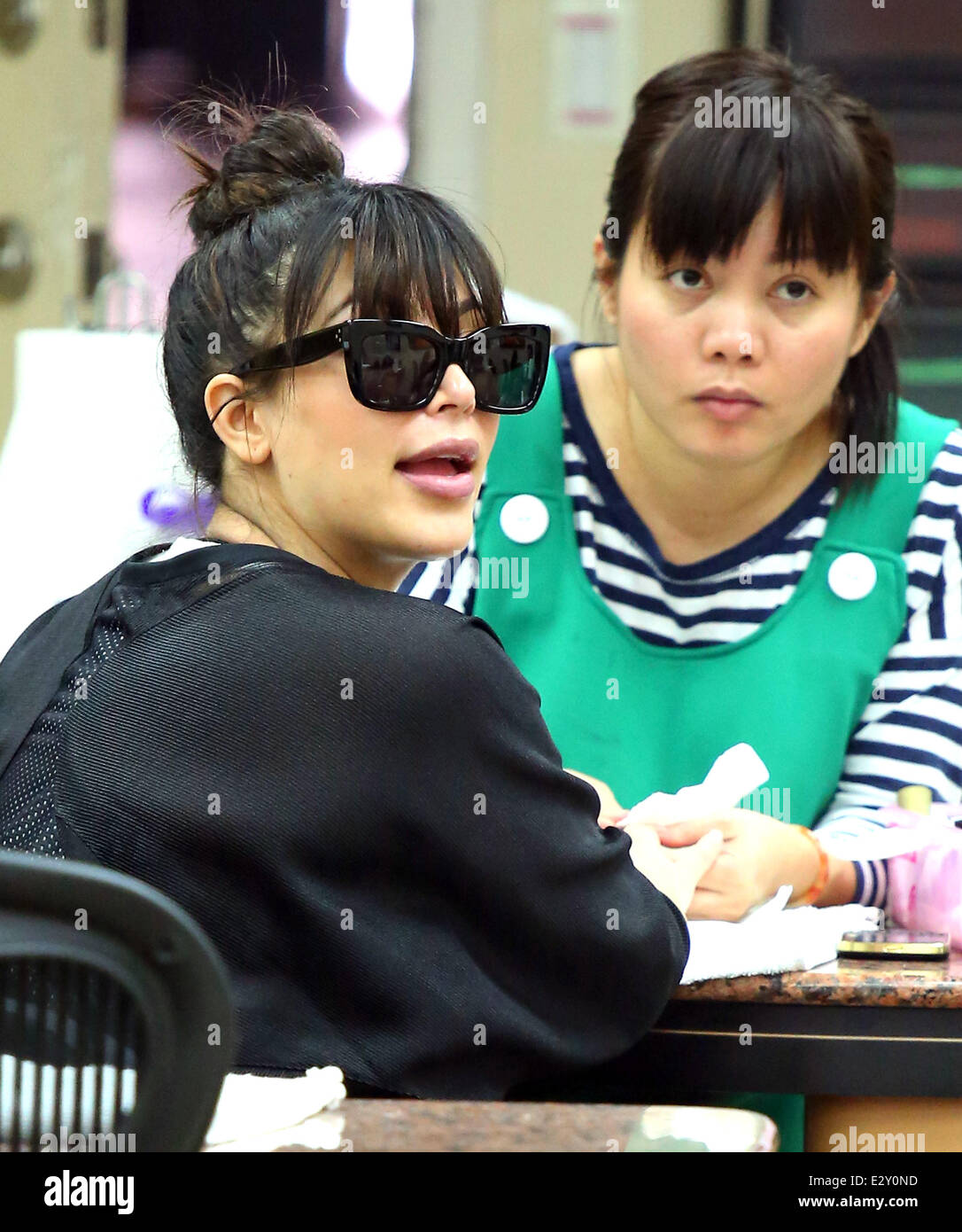 Pregnant Kim Kardashian enjoys a pampering session at a nail salon in ...