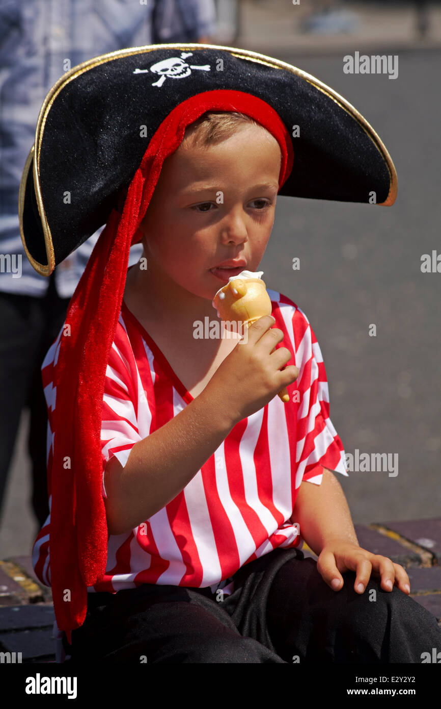 Young boy dressed as pirate eating ice cream at.Harry Paye Day, Poole ...