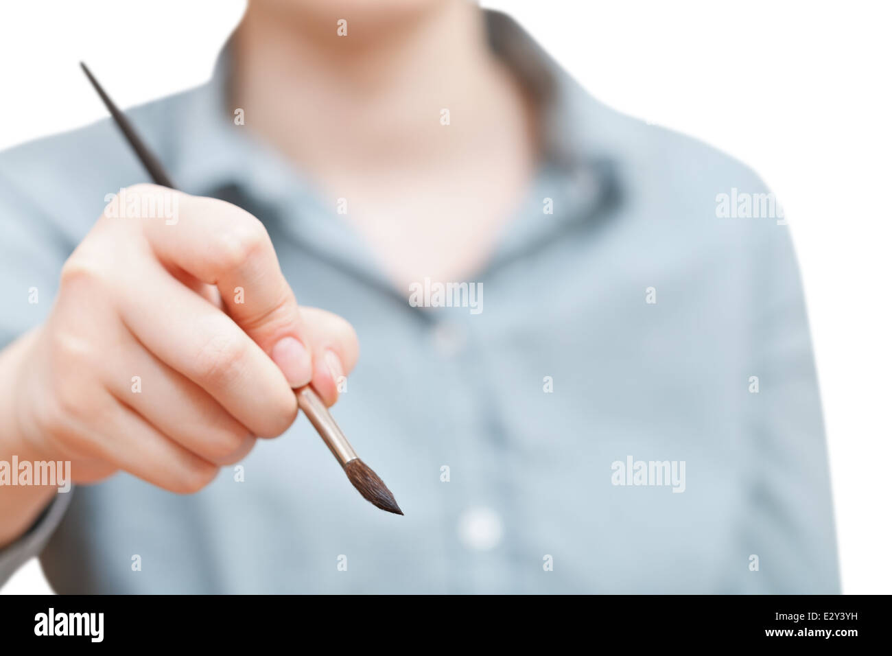 tip of paintbrush close up in female hand Stock Photo - Alamy