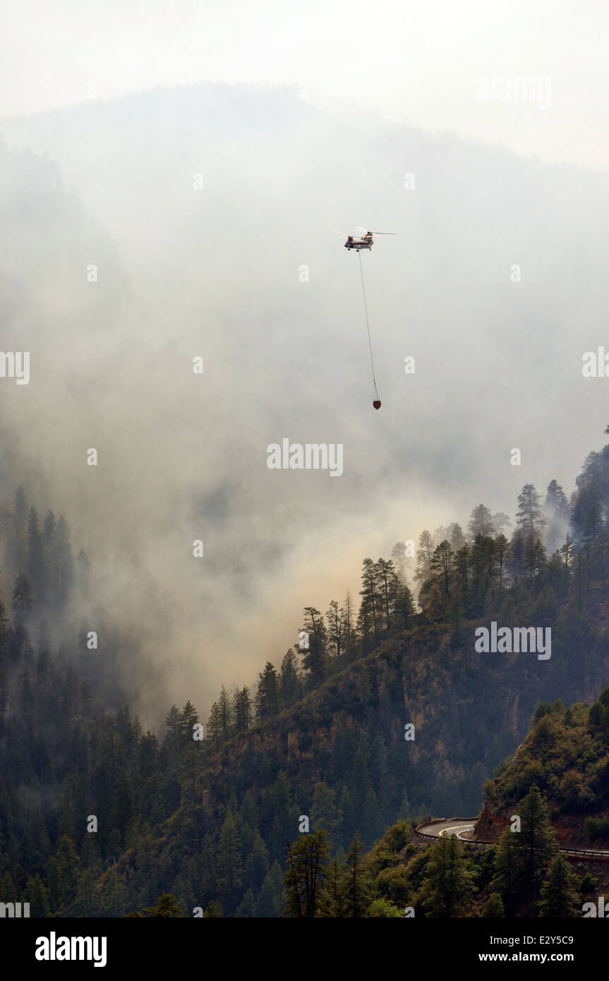 A helicopter drop during the Slide Fire in Oak Creek Canyon, aimed at ...