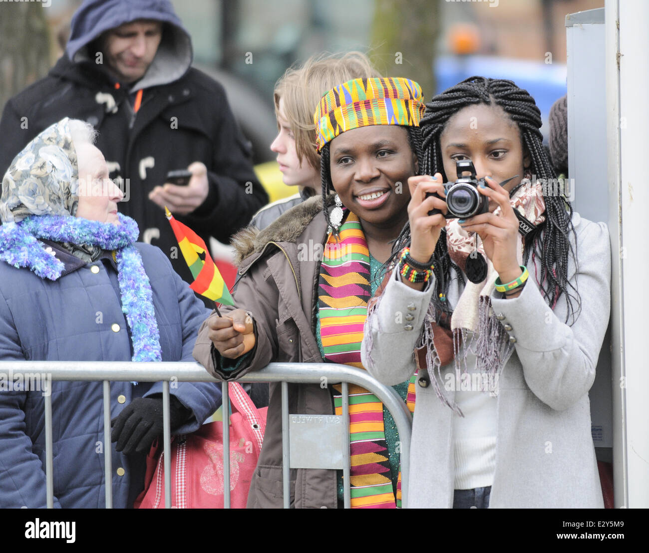 Members of the public wait to catch a glimpse of Queen Elizabeth II as ...
