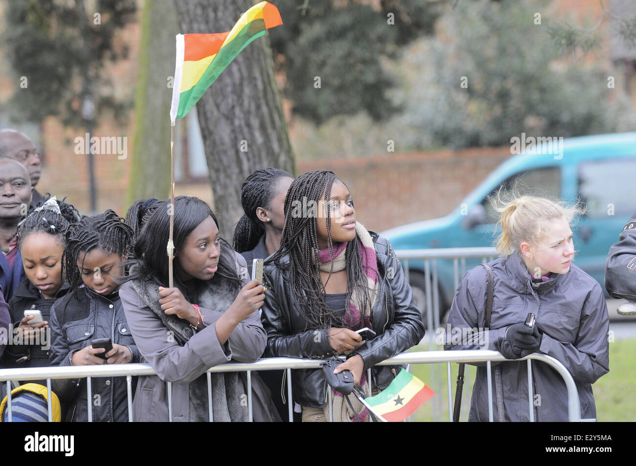 Members of the public wait to catch a glimpse of Queen Elizabeth II as ...