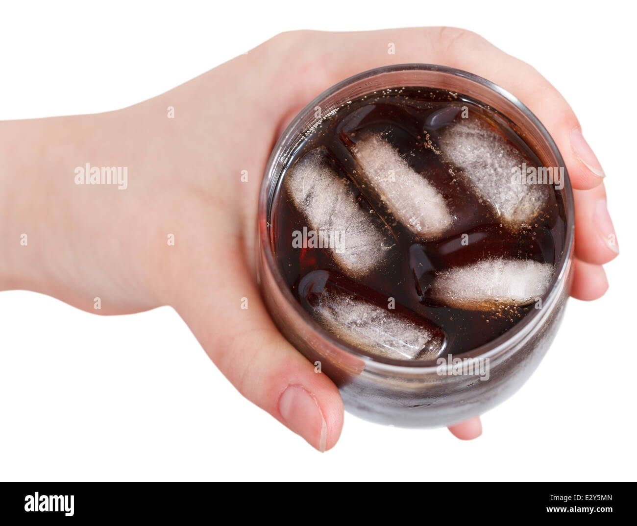 above view of hand holding cola with ice in glass isolated on white ...