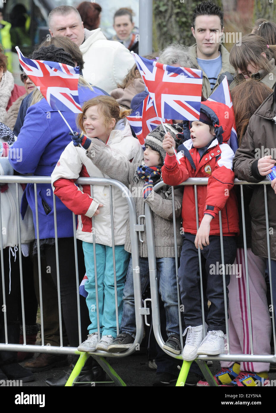 Members of the public wait to catch a glimpse of Queen Elizabeth II as ...