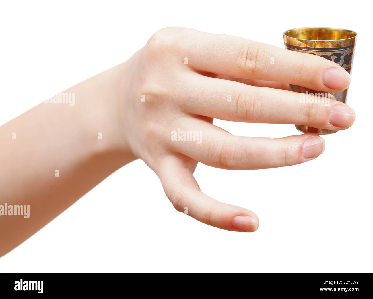 hand holds little metal glass with spirit isolated on white background ...