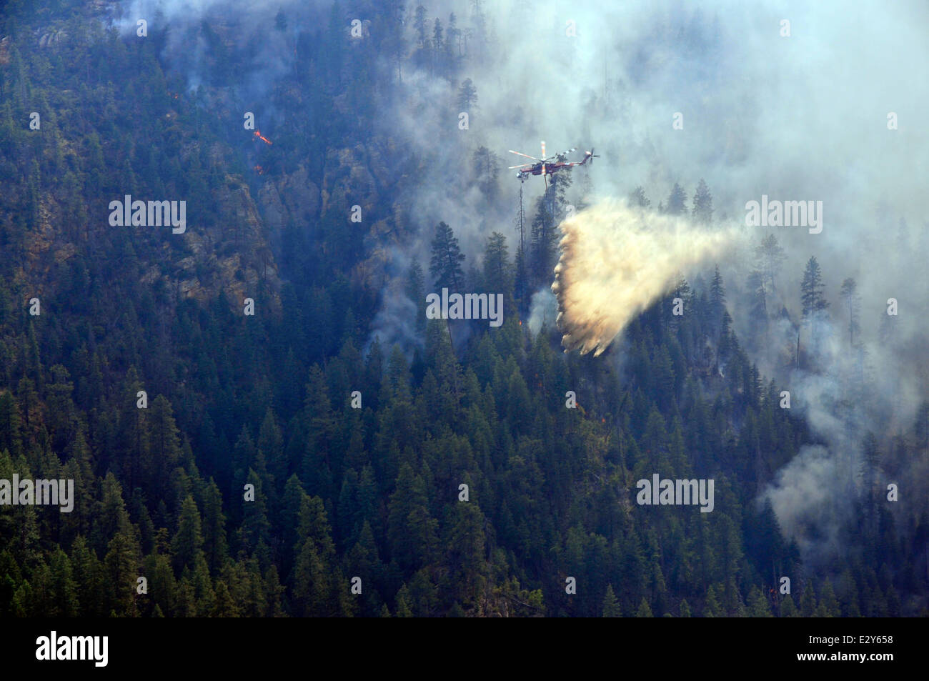 The Slide Fire, shown in this helicopter drop (Set B, #10) in Oak Creek ...