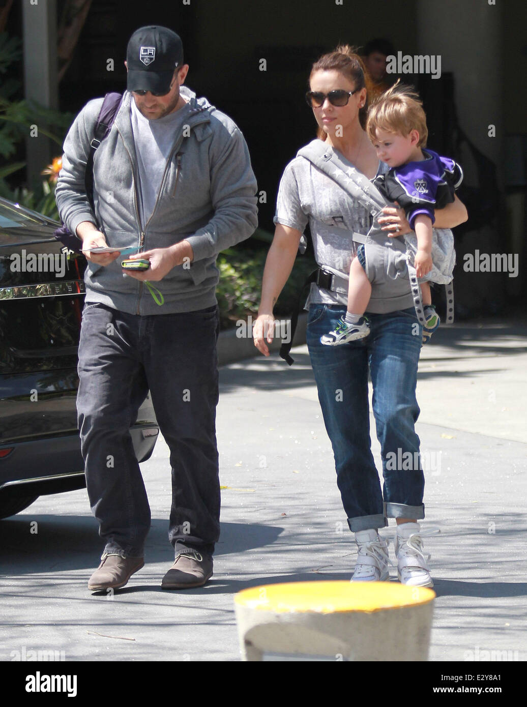 Alyssa Milano carries her son Milo Thomas as she leaves the Los Angeles ...