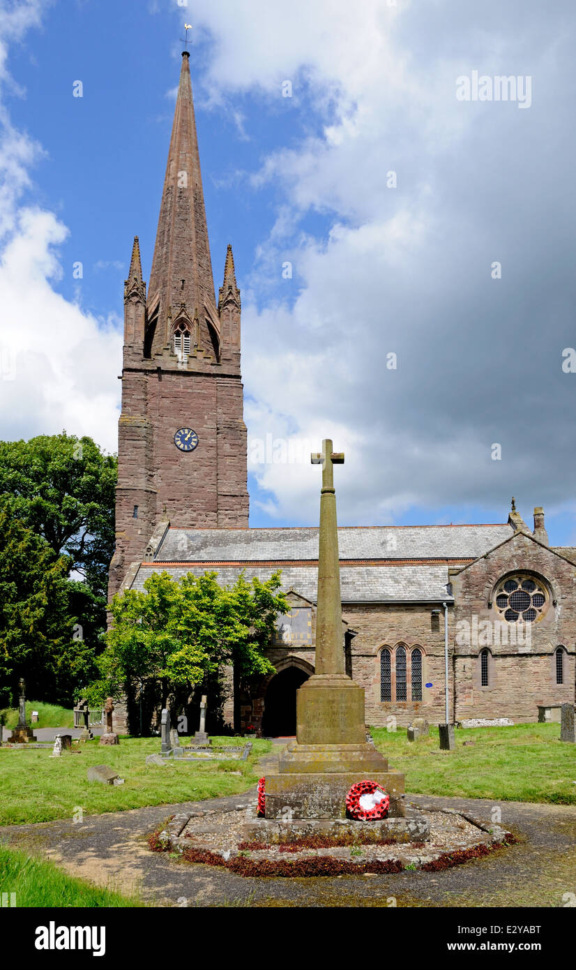 St Peter and St Paul church with the graveyard and stone cross in the ...