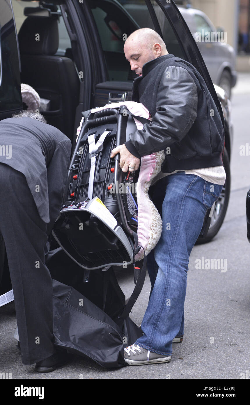 Joe Rogan seen loading a carseat in an awaiting SUV outside his SoHo ...