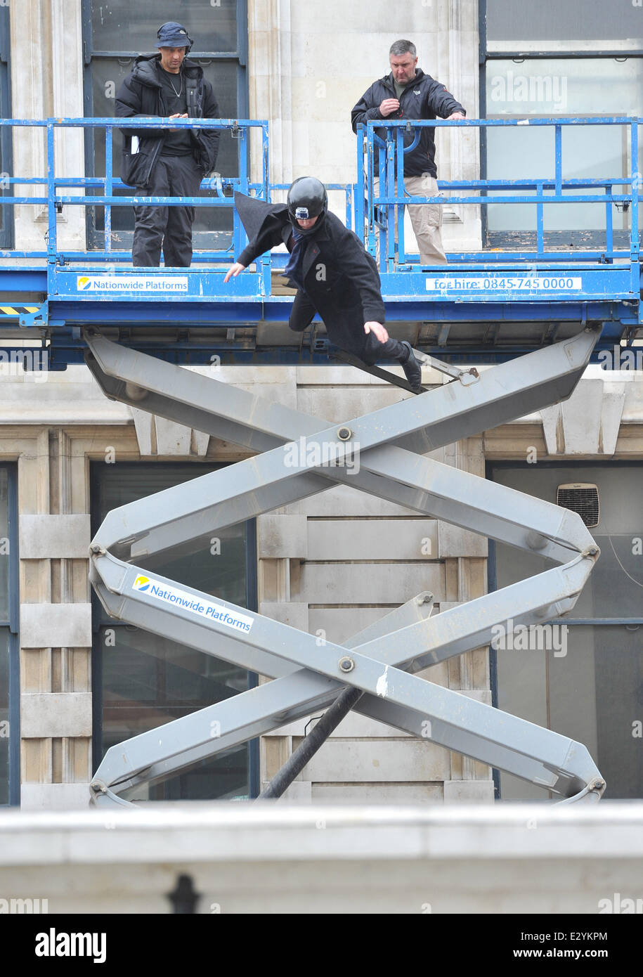 A stuntman jumps from a platform during the filming of 'Sherlock' in ...