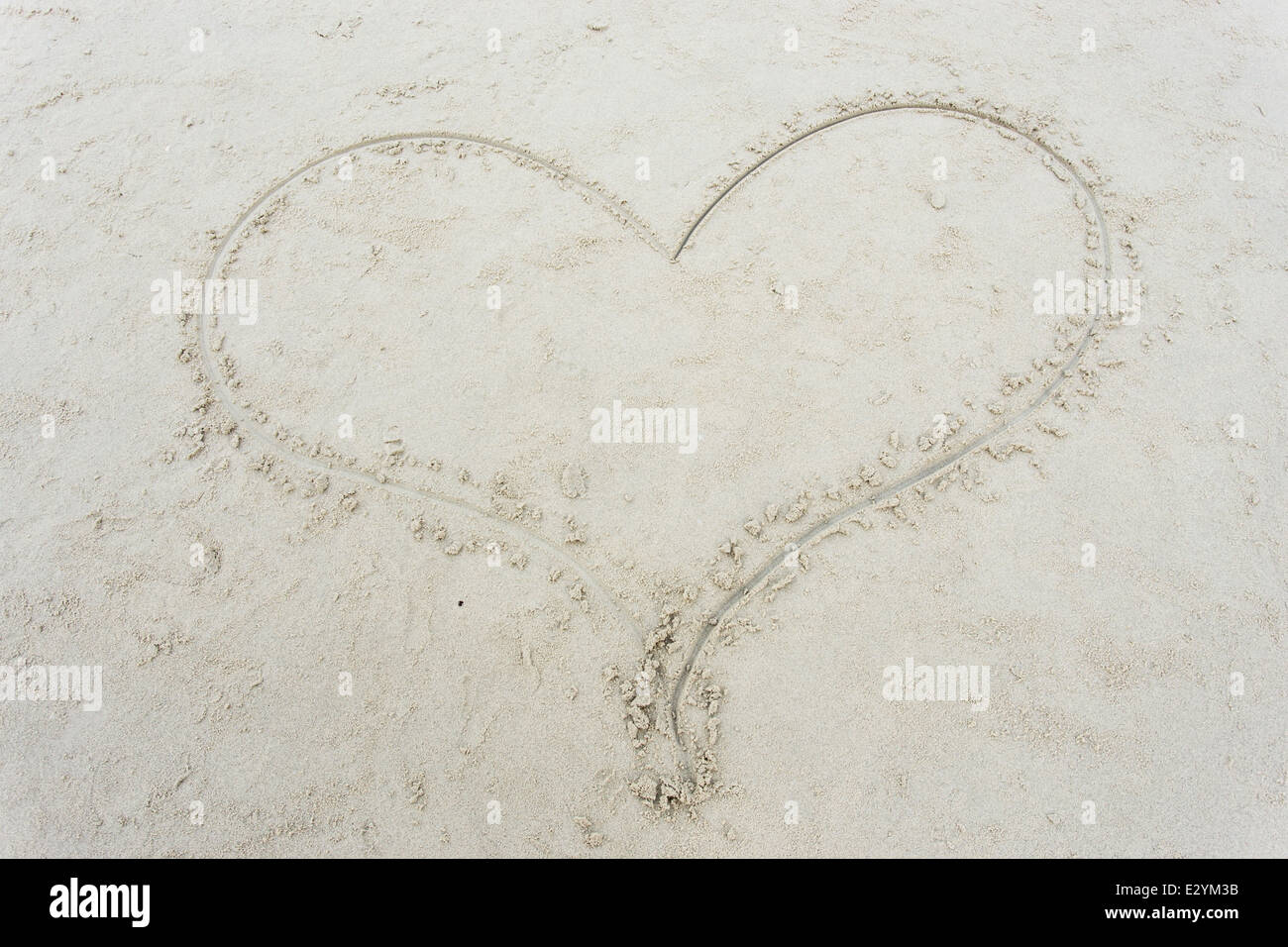 heart shape drawn on sand at beach Stock Photo - Alamy