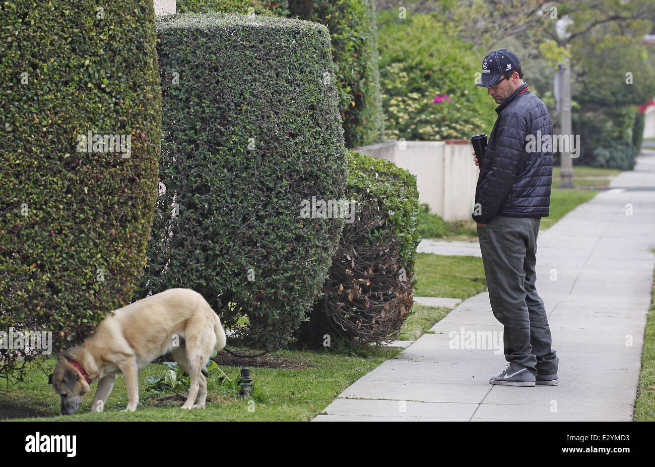 'Mad Men' star Jon Hamm walks his dog Cora, a German shepherd mix, in ...