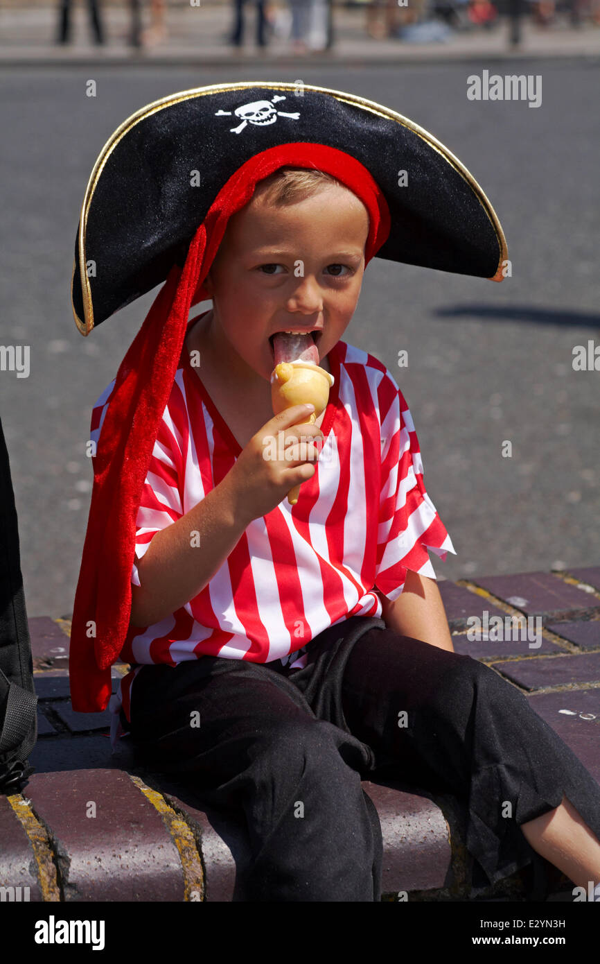 Young boy dressed as pirate eating ice cream at.Harry Paye Day, Poole ...