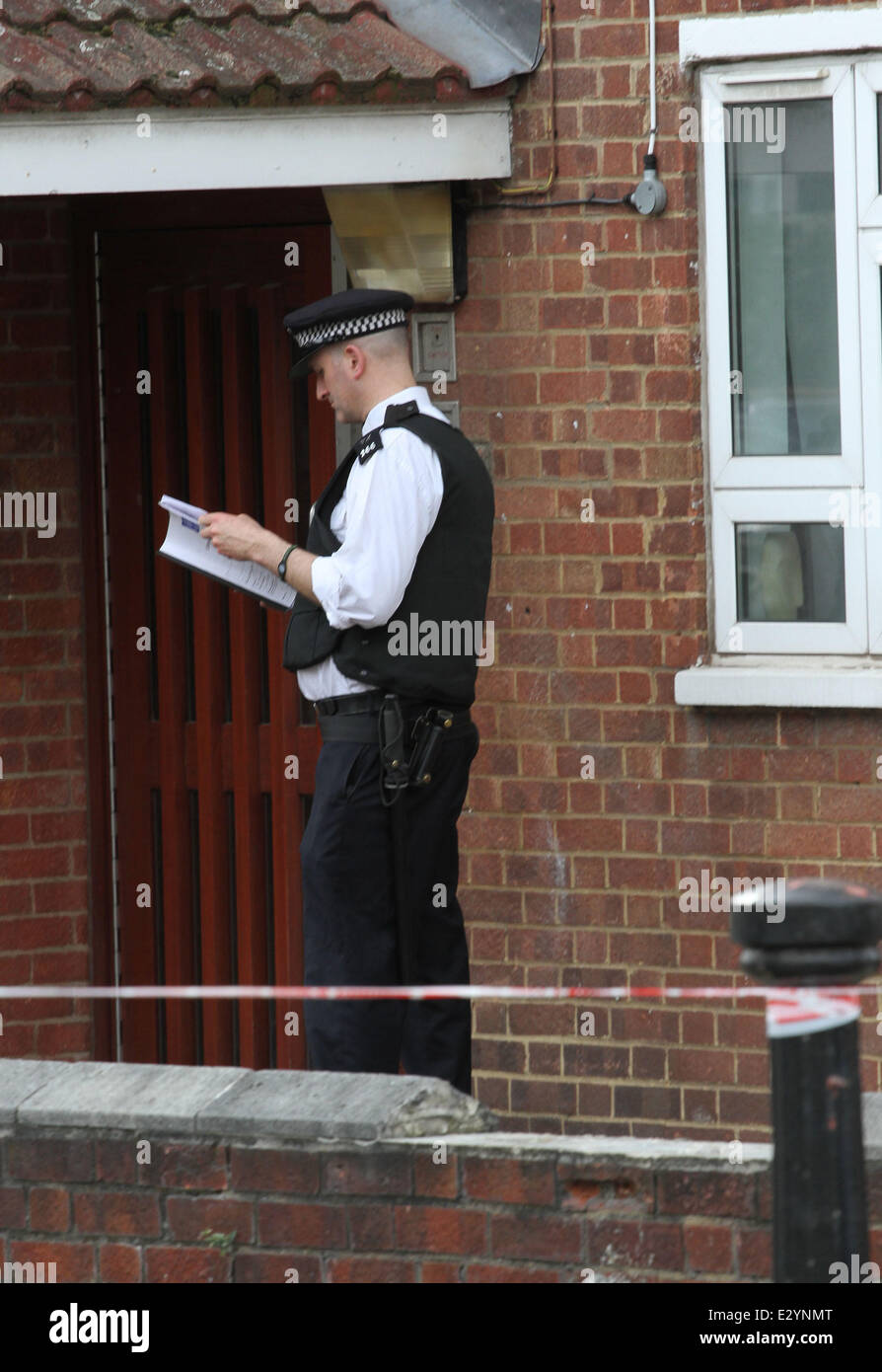 Police Officers set up a cordon and inspect a crime scene after they ...