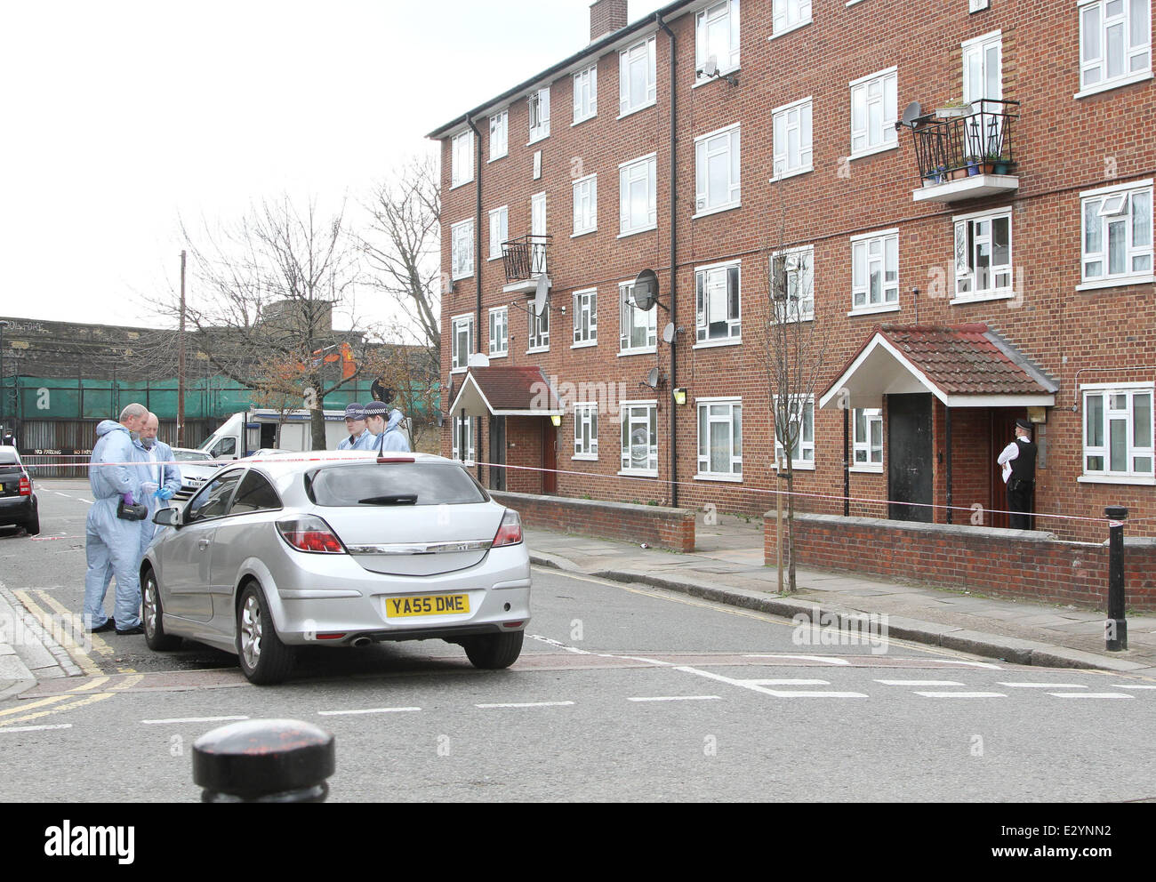 Police Officers set up a cordon and inspect a crime scene after they ...