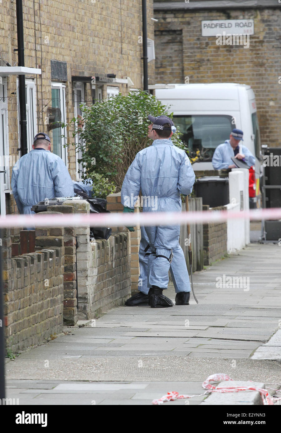 Police Officers set up a cordon and inspect a crime scene after they ...