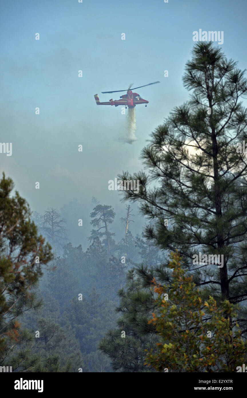 A water drop by helicopter during firefighting efforts in the Coconino ...