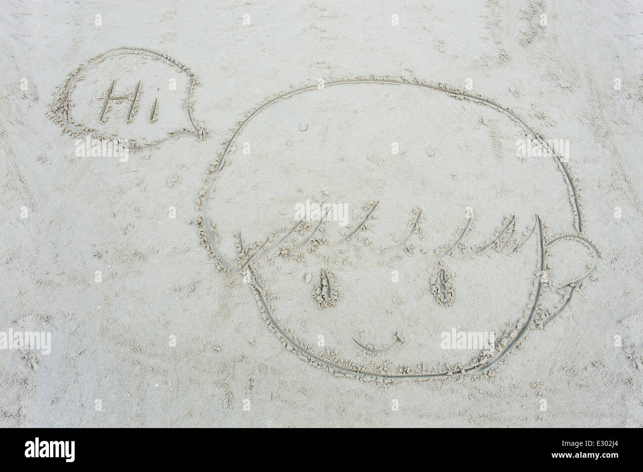 cartoon face of little boy drawn on the sand at beach Stock Photo - Alamy