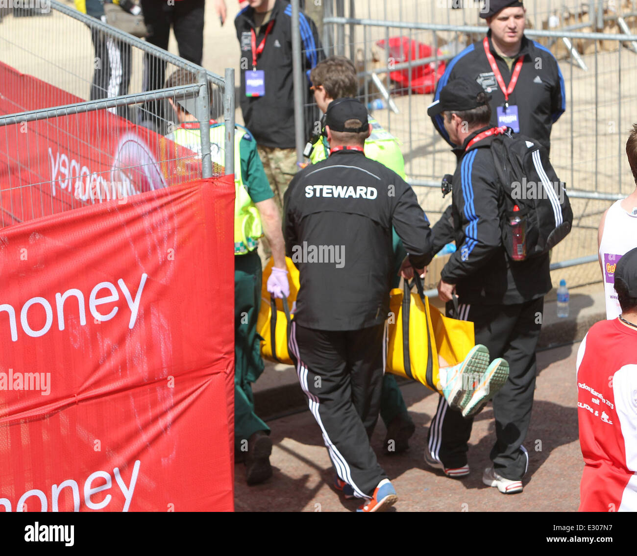A participant is carried off in a stretcher by a medical team during ...