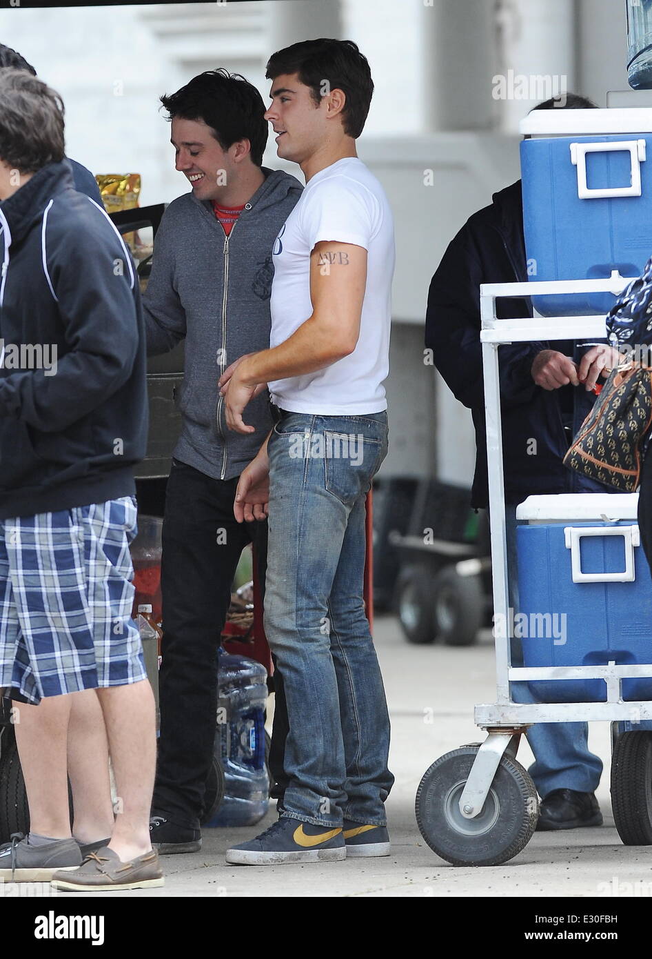 Actor Zac Efron sports a marijuana belt buckle with a white tight t ...