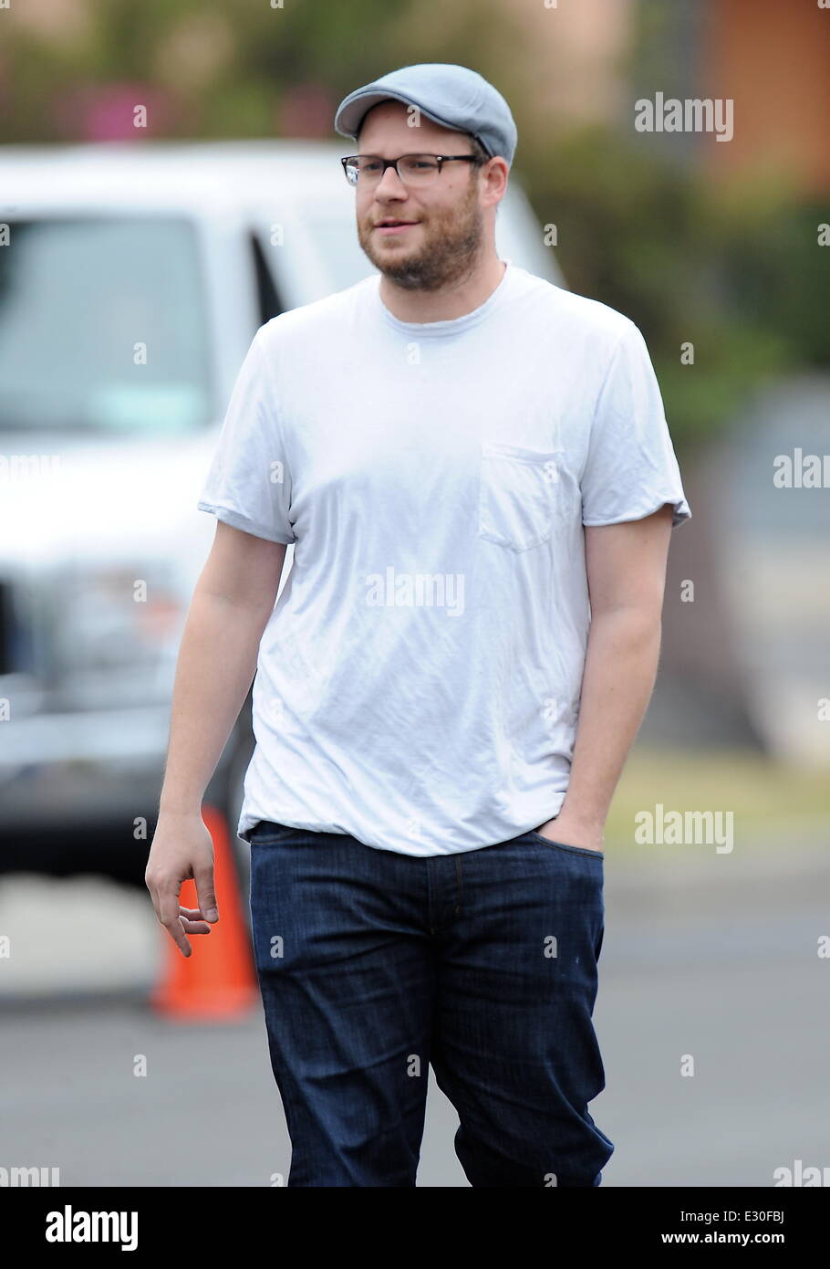 Actor Zac Efron sports a marijuana belt buckle with a white tight t ...